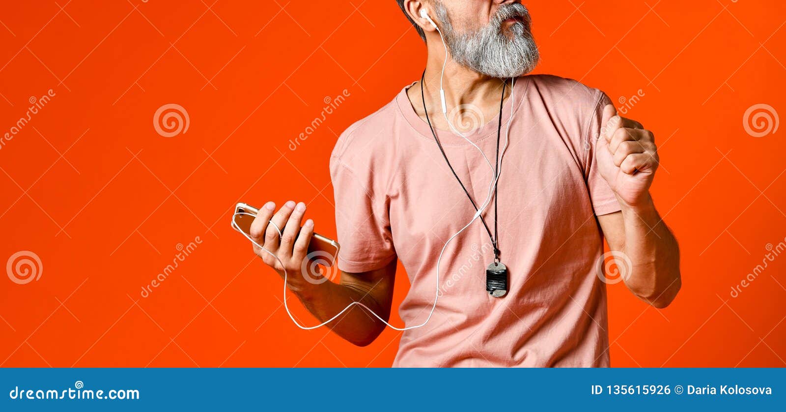 An Image Of An Elderly Bald Head Man Listening To Music With Headphones