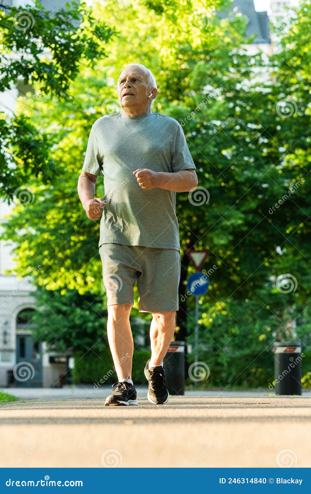 Elderly Man during His Jogging Workout in a City Park Stock Photo ...