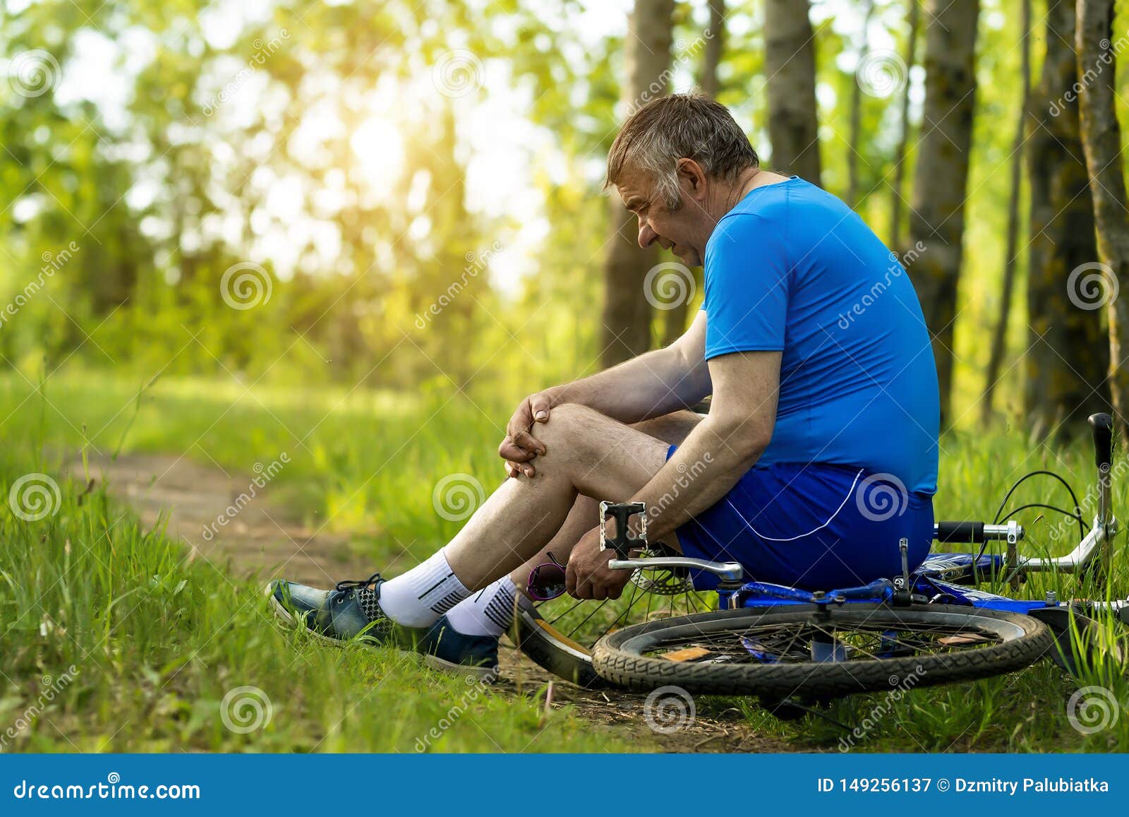 An Elderly Man Hurt His Leg while Riding a Bicycle Stock Image - Image ...