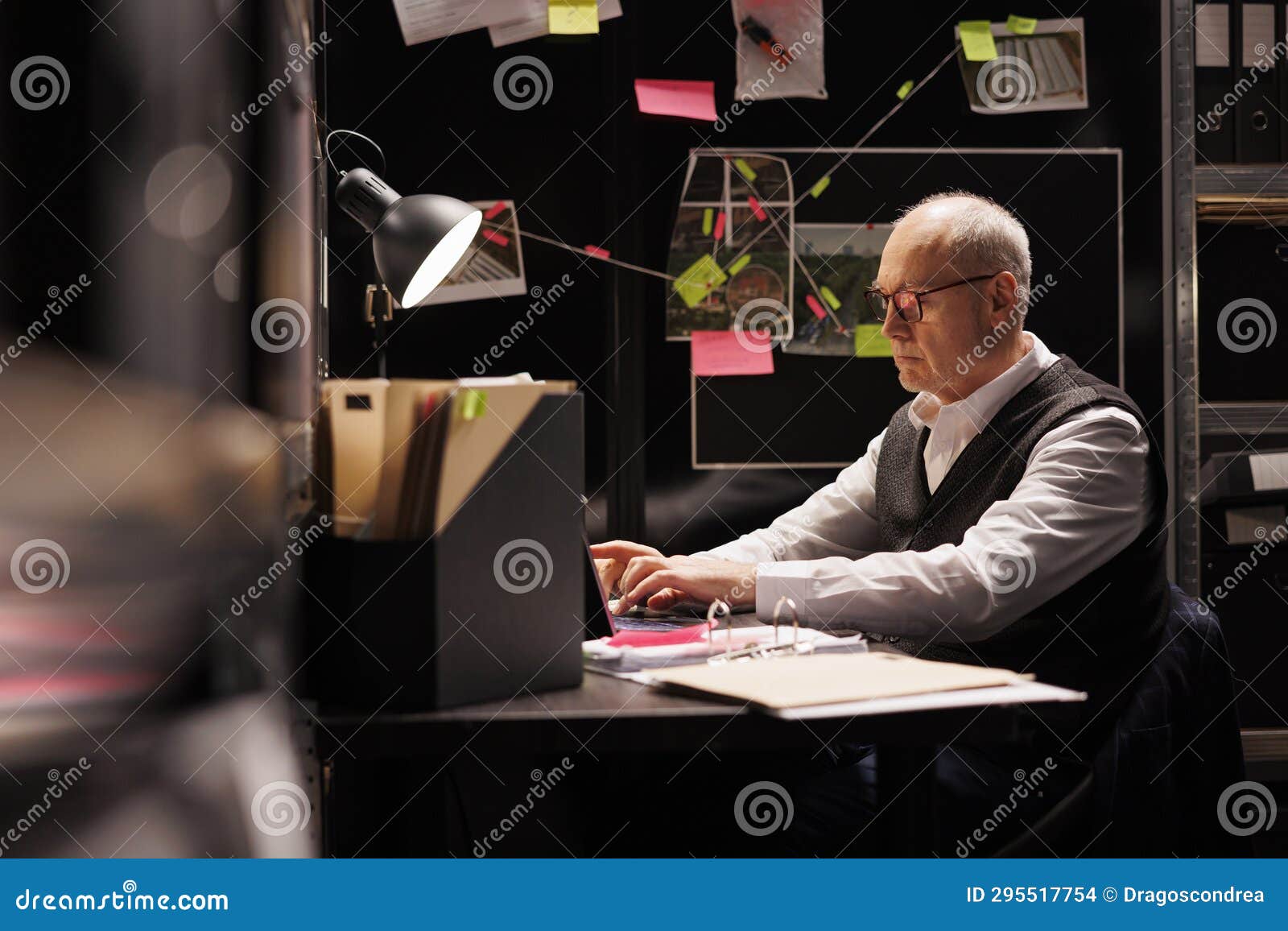 Elderly Man Inspector Sitting at Desk Table in Evidence Room Stock ...