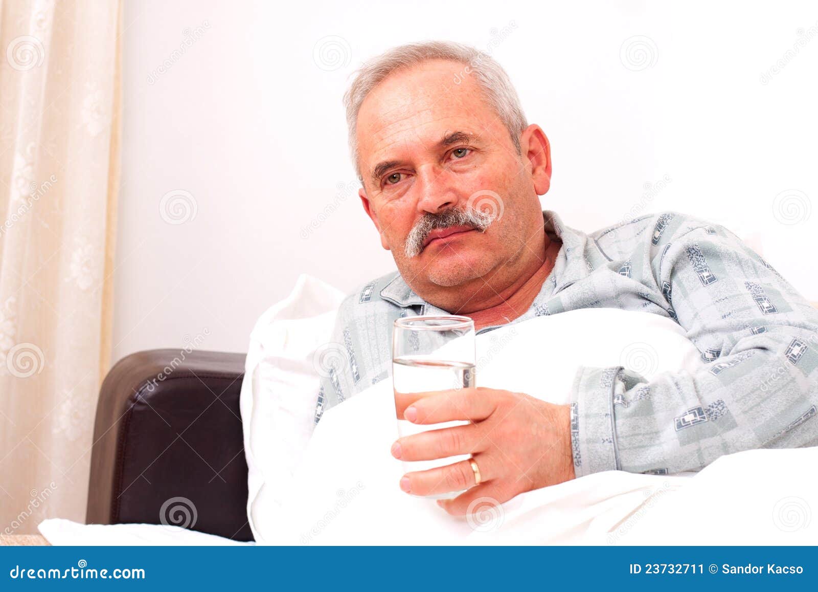 Elderly man laying in bed stock image. Image of elderly - 23732711