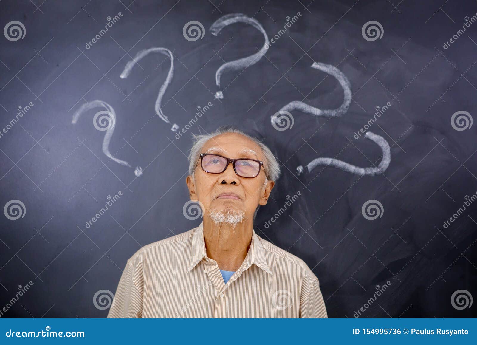 Elderly Man Looking at Question Marks Stock Photo - Image of hair ...