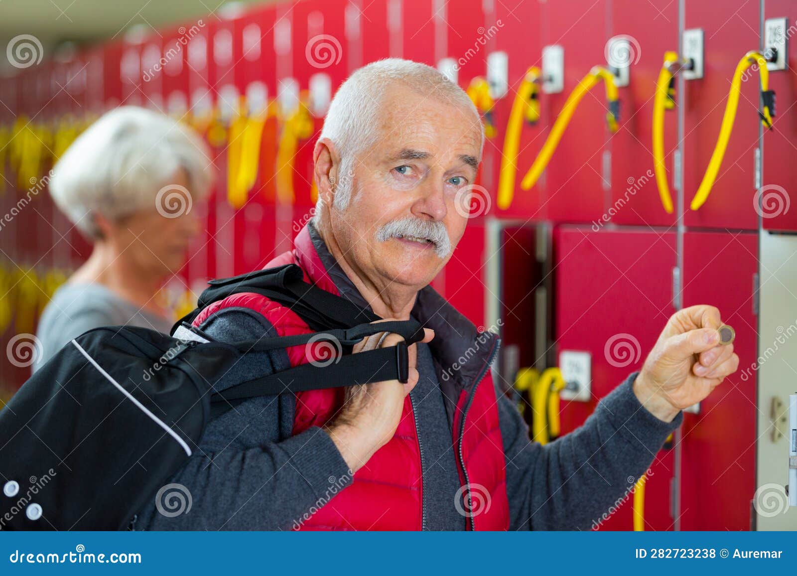 Elderly man opening locker stock photo. Image of cabinet - 282723238