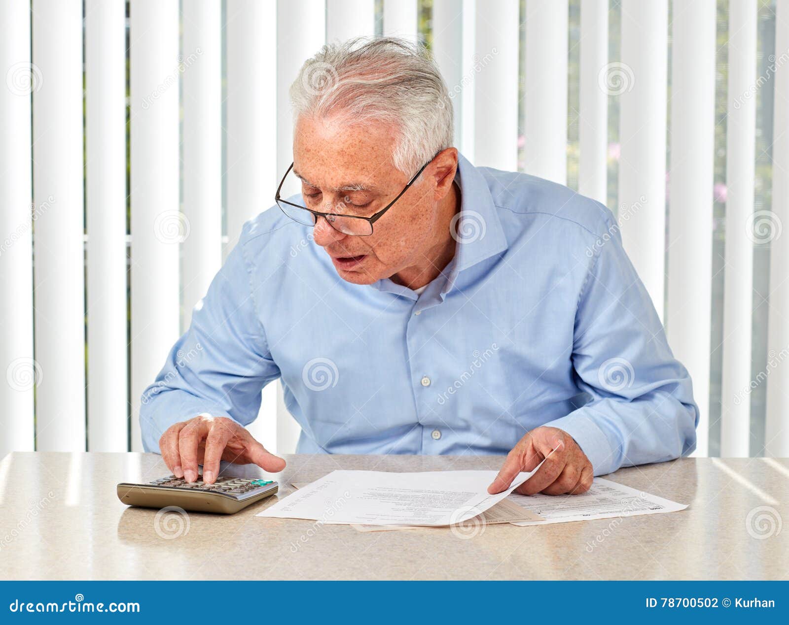 Elderly man with papers. stock photo. Image of concern - 78700502