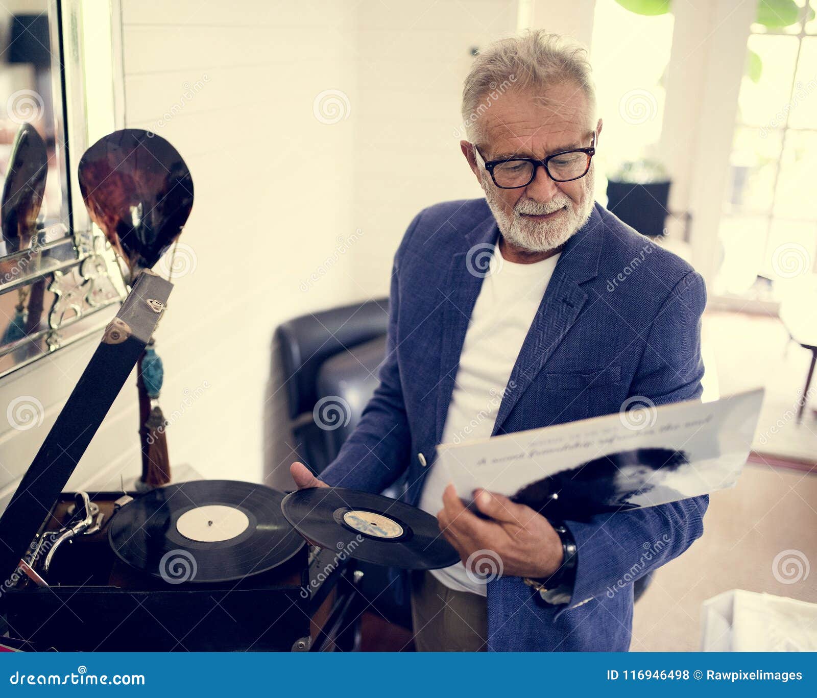 An Elderly Man Playing a Record Stock Photo - Image of vintage ...