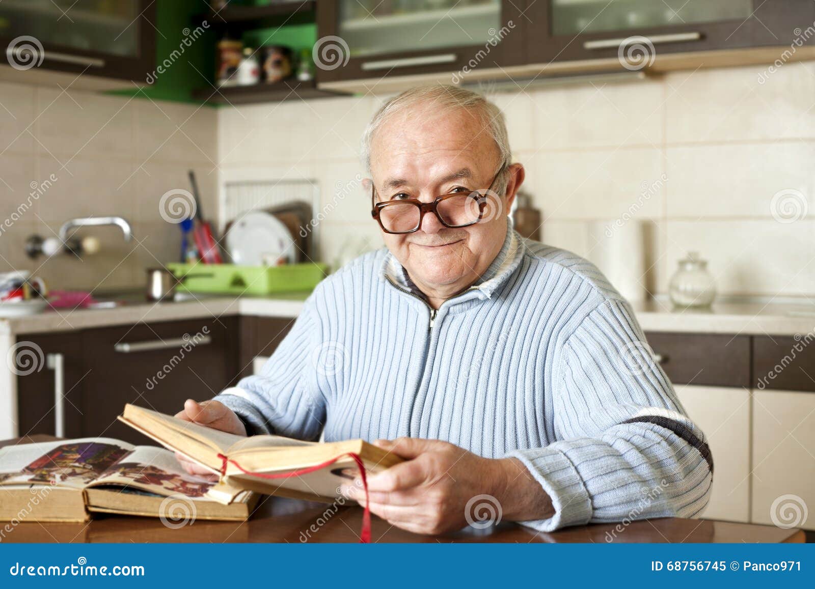 Elderly man reading a book stock image. Image of adult - 68756745