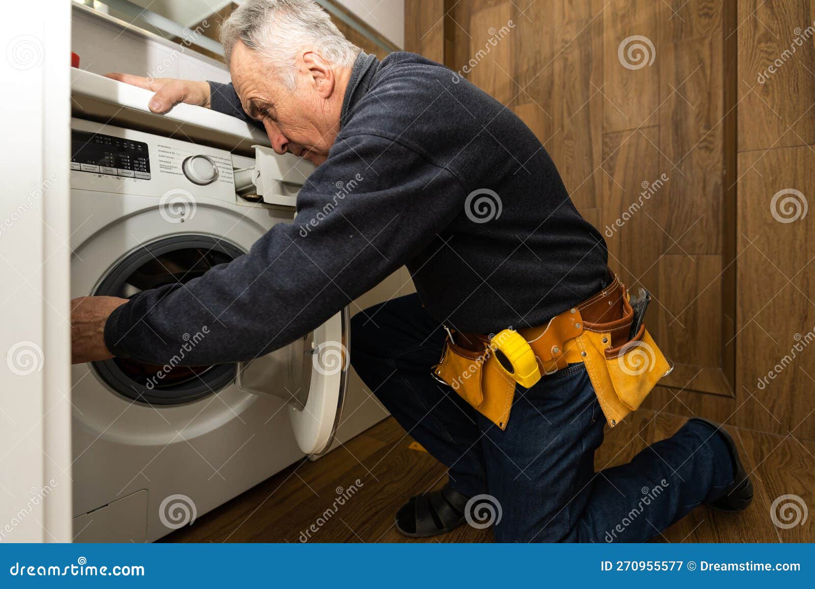 An Elderly Man Repairs a Washing Machine. Stock Image - Image of engine ...