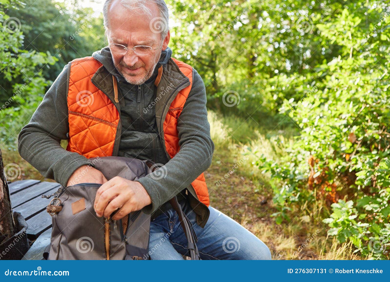 Elderly Man Searching in Backpack during Summer Vacation Stock Image ...