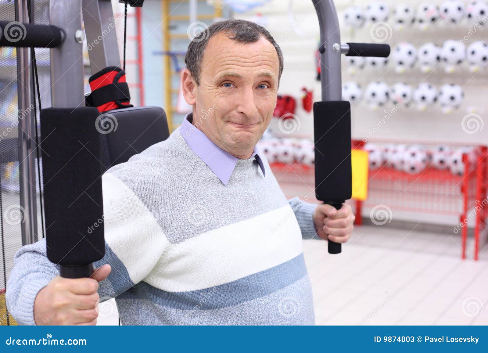 Elderly Man in Shop on Sports Exerciser Stock Image - Image of product ...