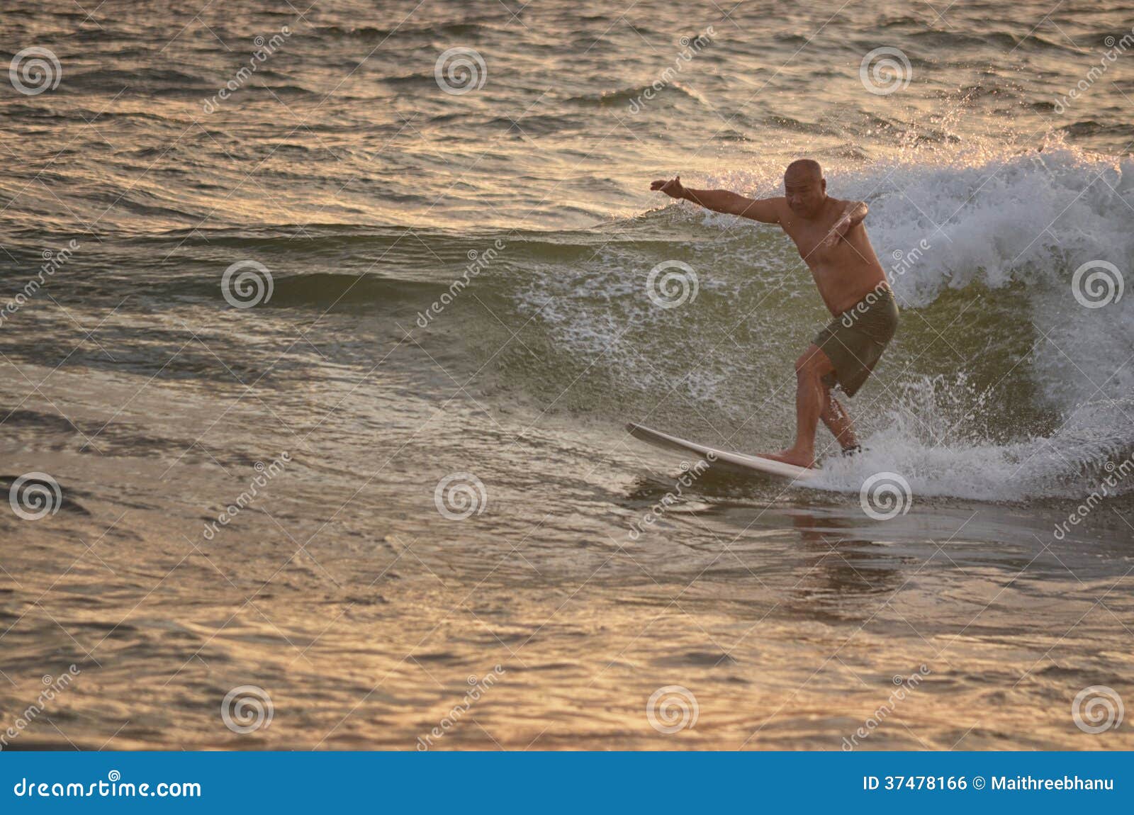 Elderly Man Surfing on the Golden Waves Editorial Photo - Image of ...