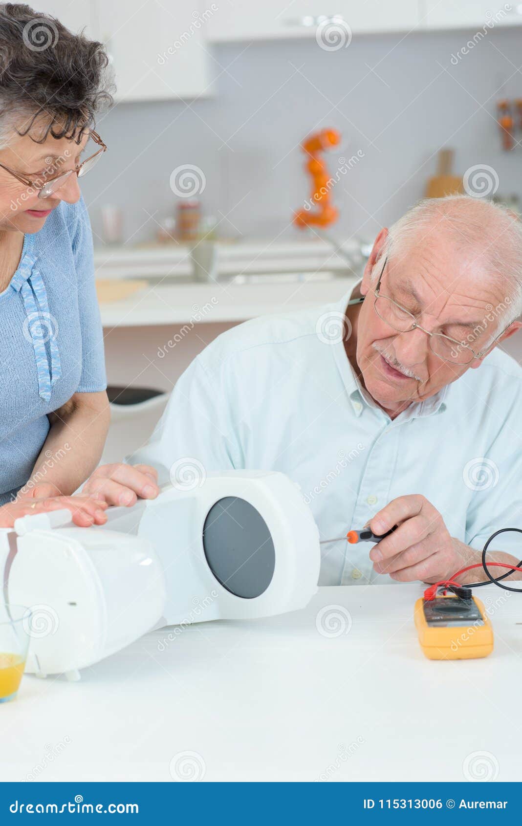 Elderly Man Testing Cafetiere with Multimeter Stock Photo - Image of ...