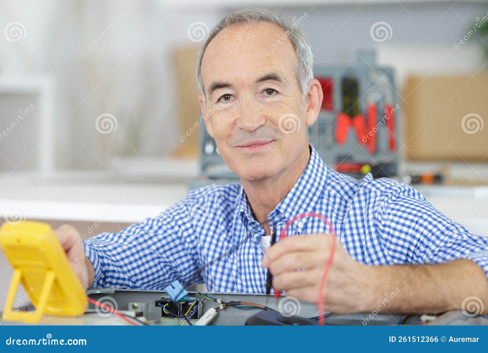 Elderly Man Testing with Voltage Measurer Stock Photo - Image of ...
