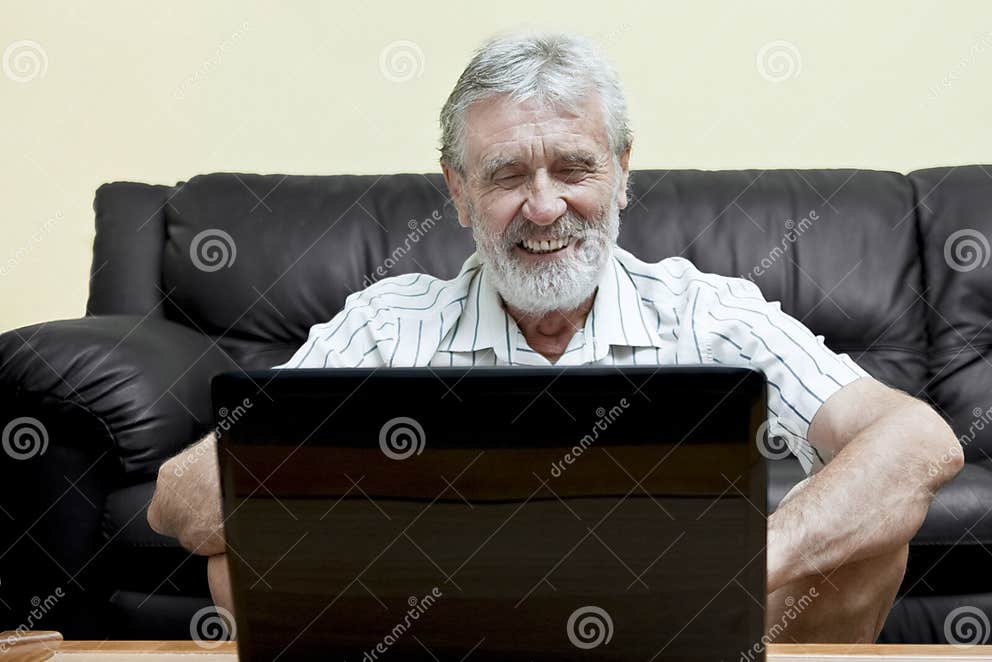 Elderly man using computer stock photo. Image of pension - 20132020