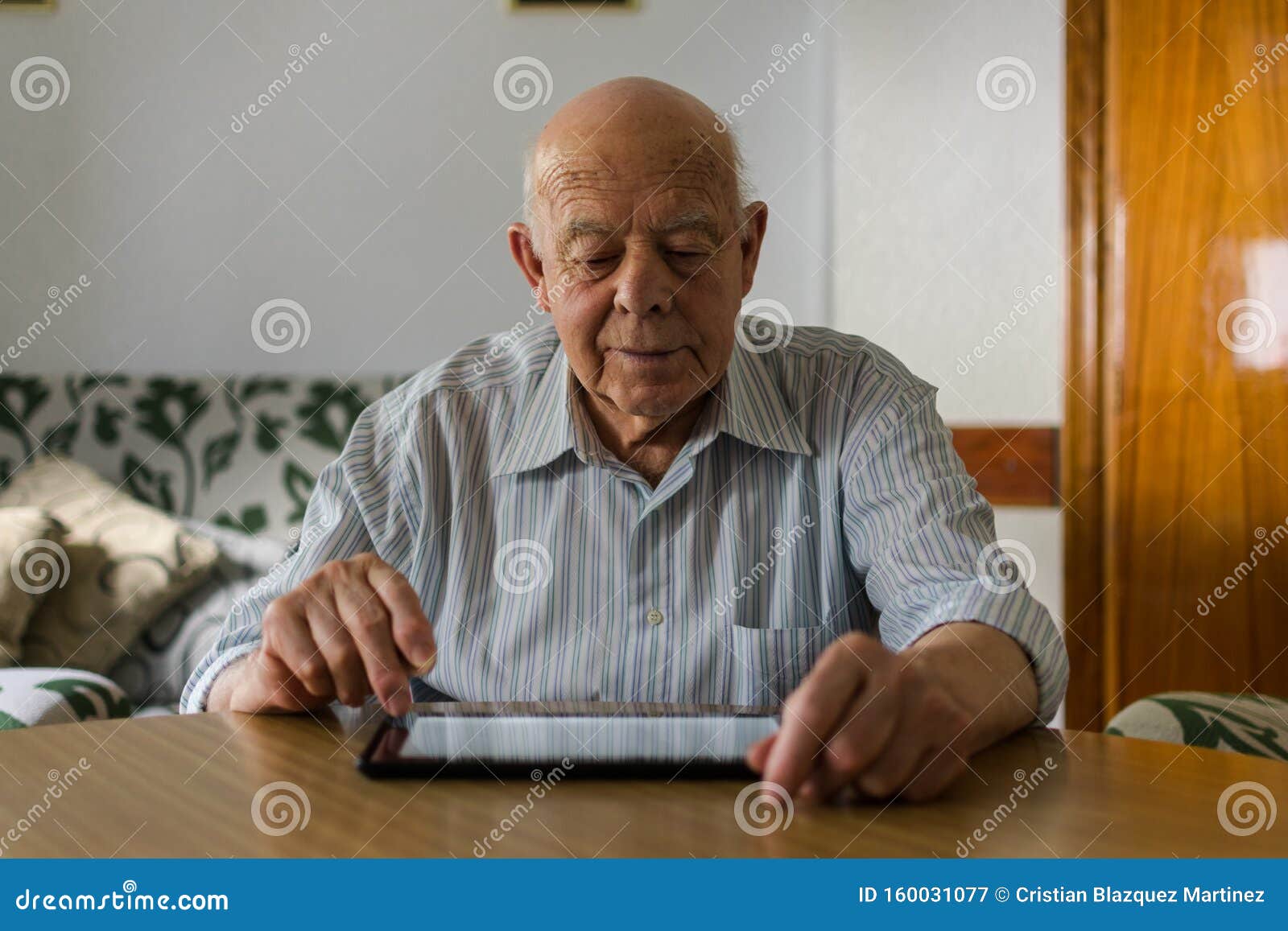 Elderly Man is Using a Digital Tablet at Home Stock Image - Image of ...