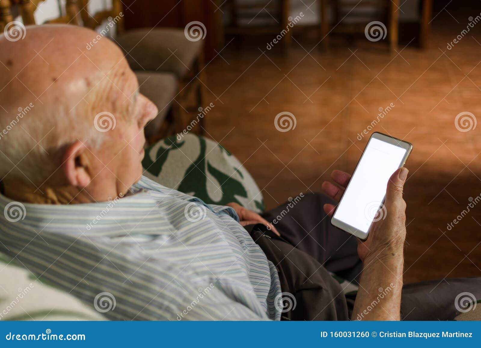 Elderly Man is Using His Smartphone at Home Stock Photo - Image of ...