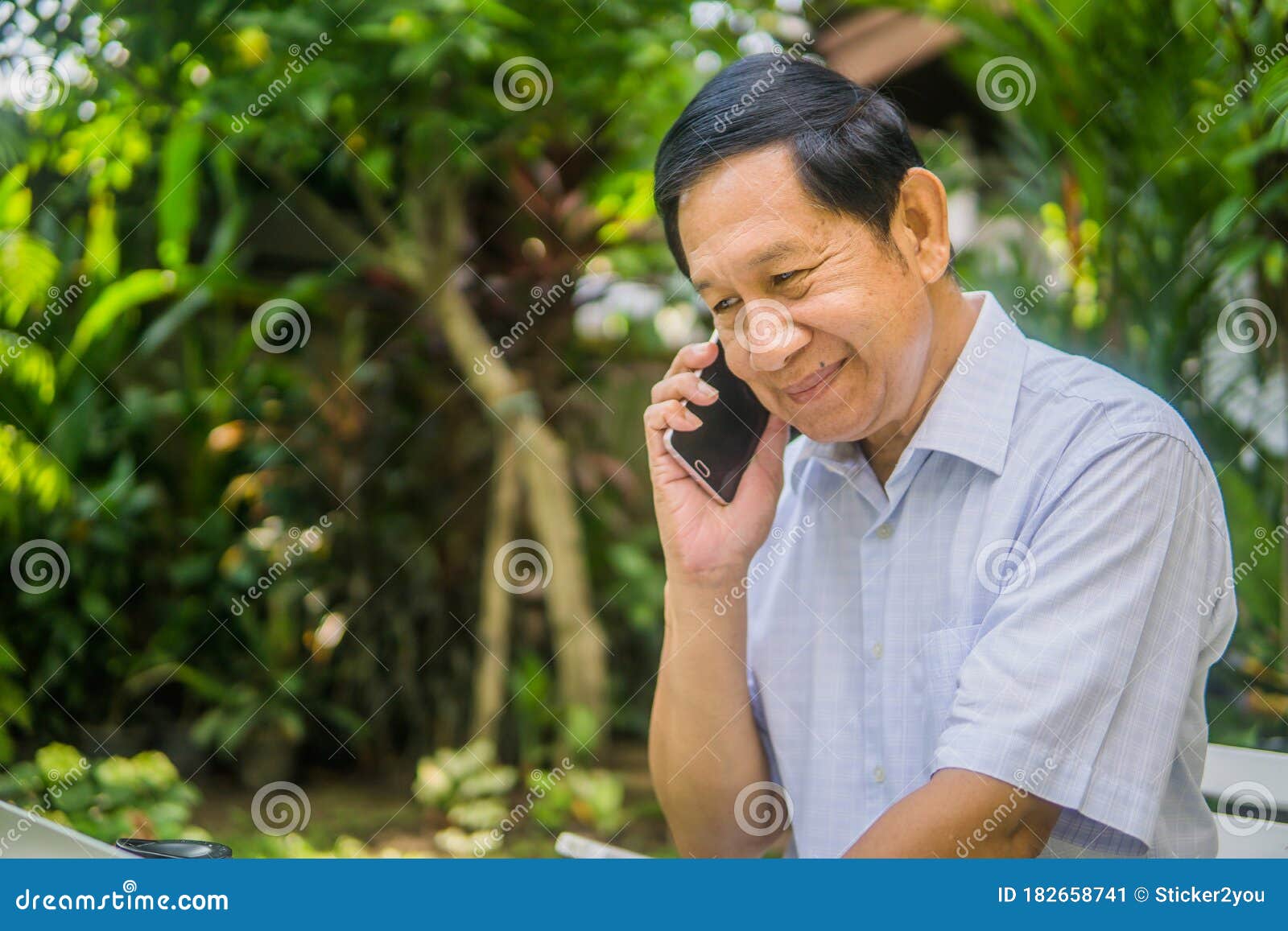 Elderly Man Using and Looking at His Smart Phone Stock Image - Image of ...