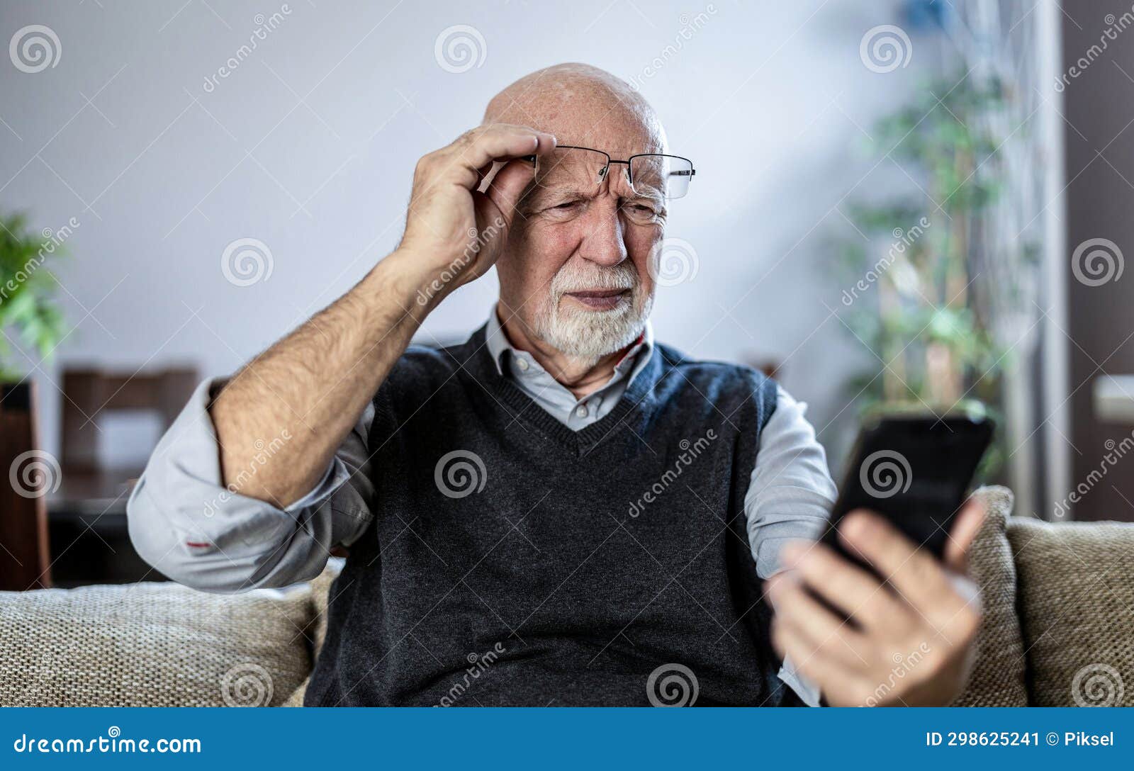 Elderly Man Using Mobile Phone at Home Stock Image - Image of domestic ...