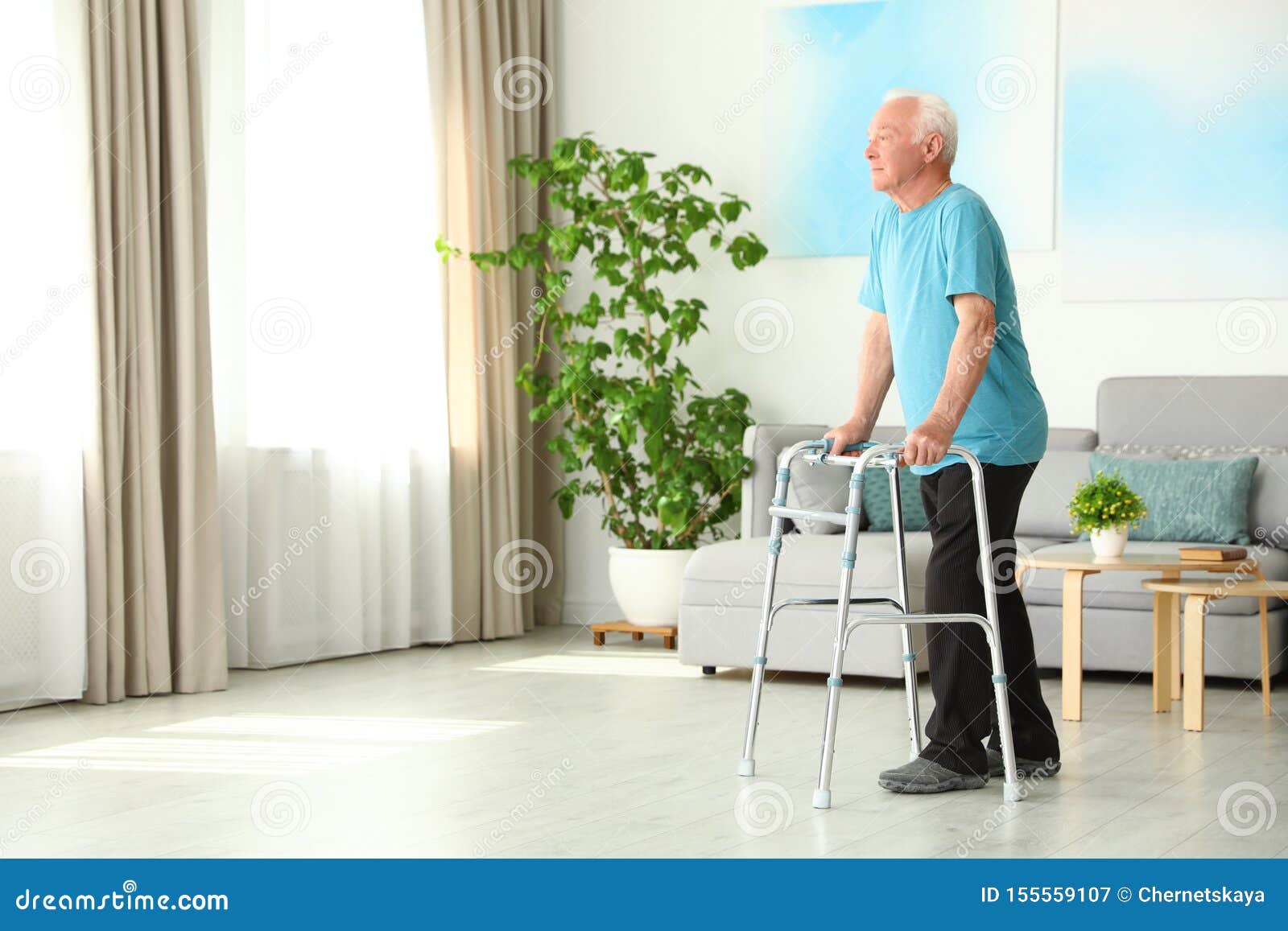 Elderly Man Using Walking Frame Indoors. Space for Stock Image - Image ...