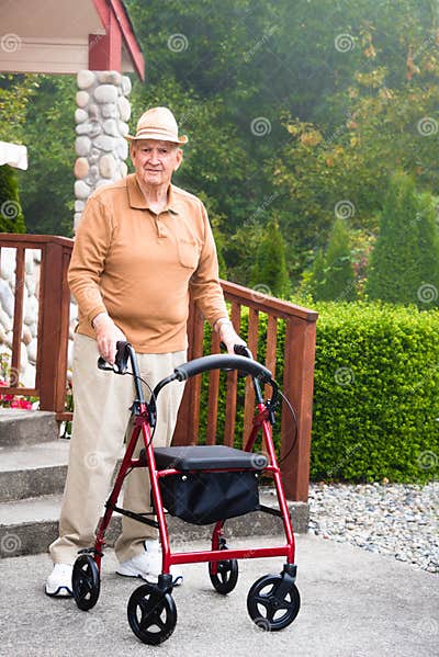 Elderly Man with Walker stock photo. Image of foliage - 26760304