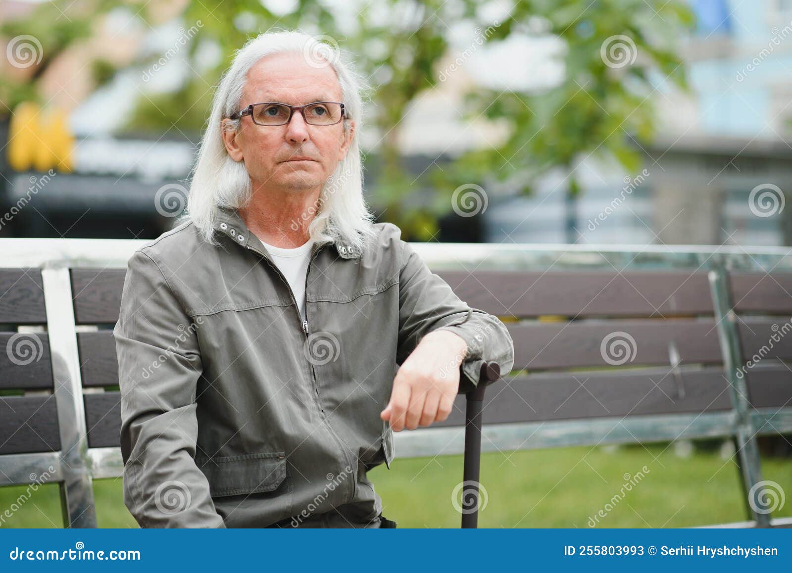 Elderly Man Walks With A Cane In A City Spring Park Stock Image