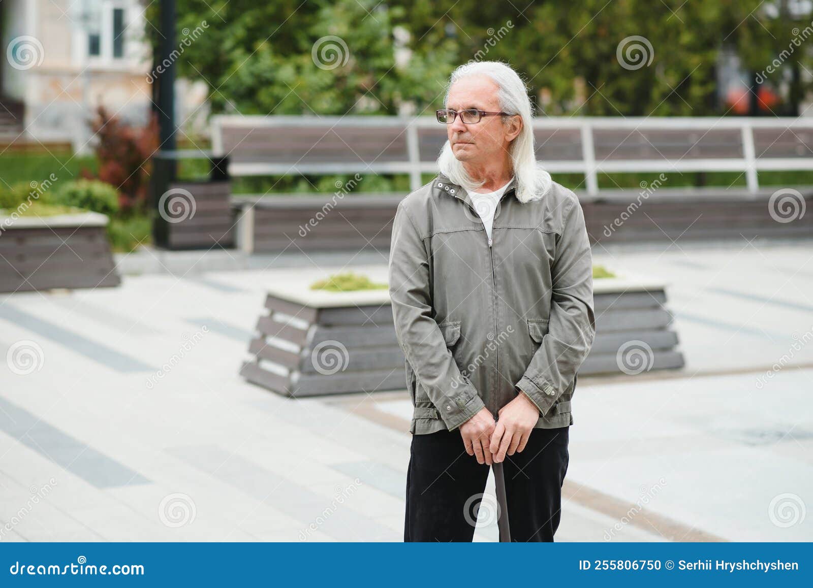 Elderly Man Walks with a Cane in a City Spring Park. Stock Photo ...