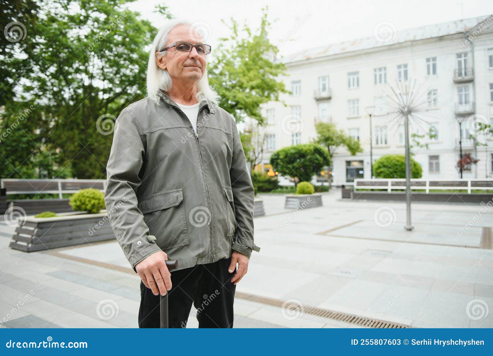 Elderly Man Walks with a Cane in a City Spring Park. Stock Image ...