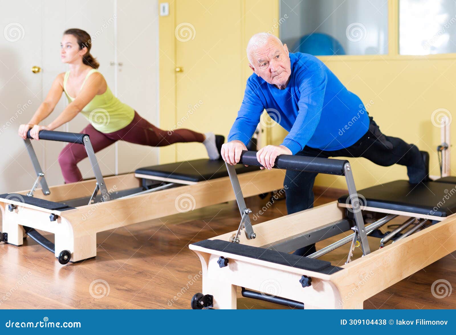 Elderly Man Press Exercises on Pilates Reformer at Studio Stock Photo ...