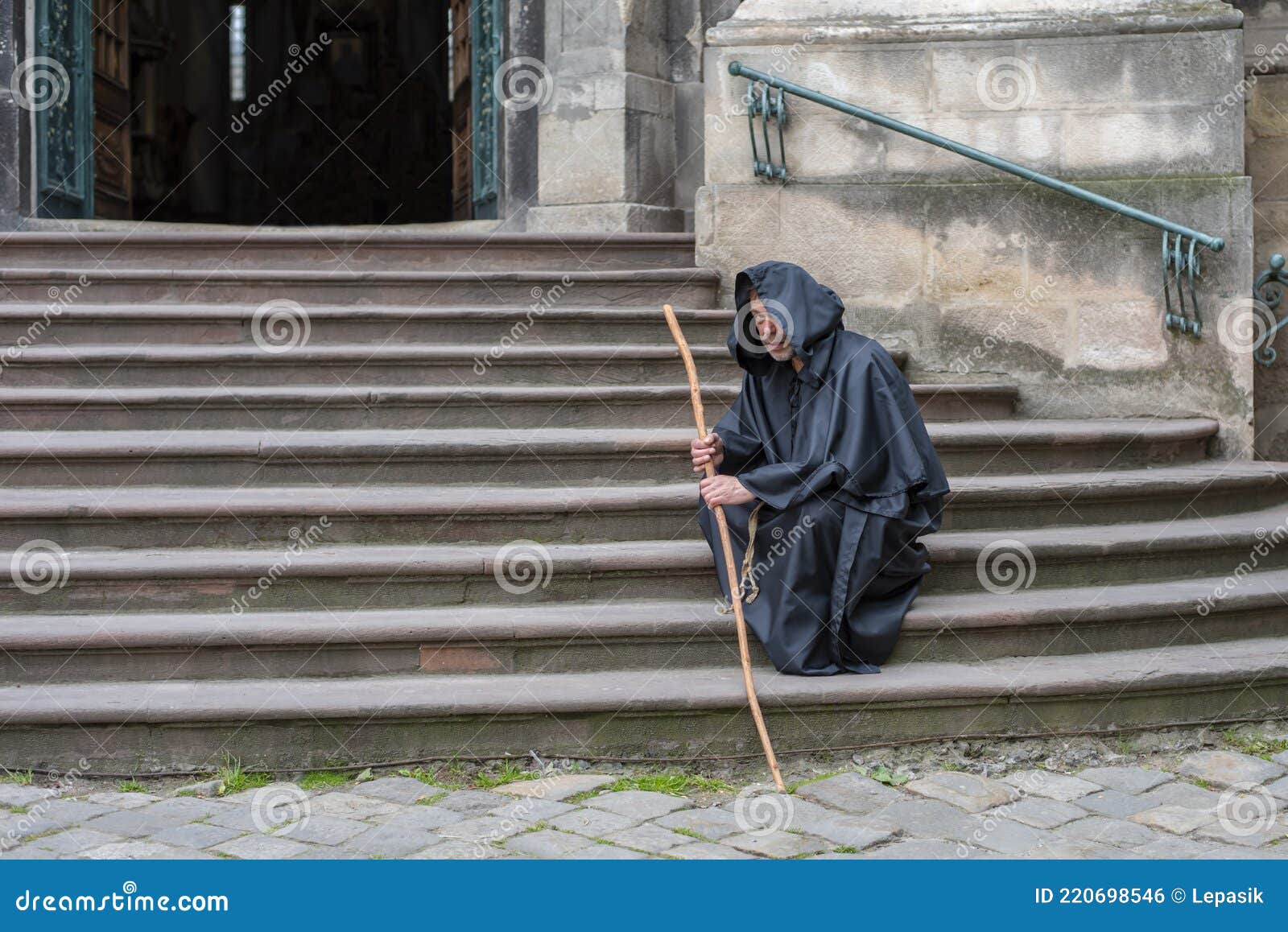 An Elderly Monk with a Staff Sits on the Steps of the Temple and Asks ...