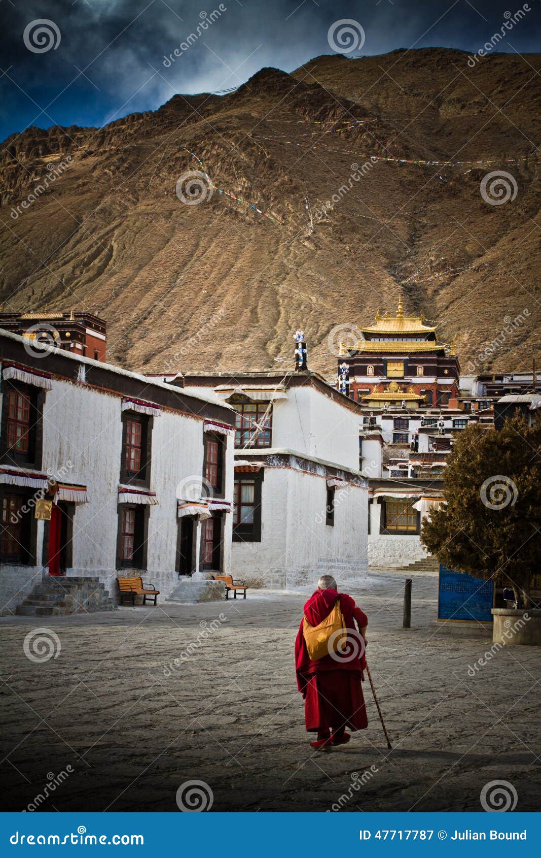 An Elderly Monk Of 45-50 Years Old With A Beard And A Black Robe With A ...