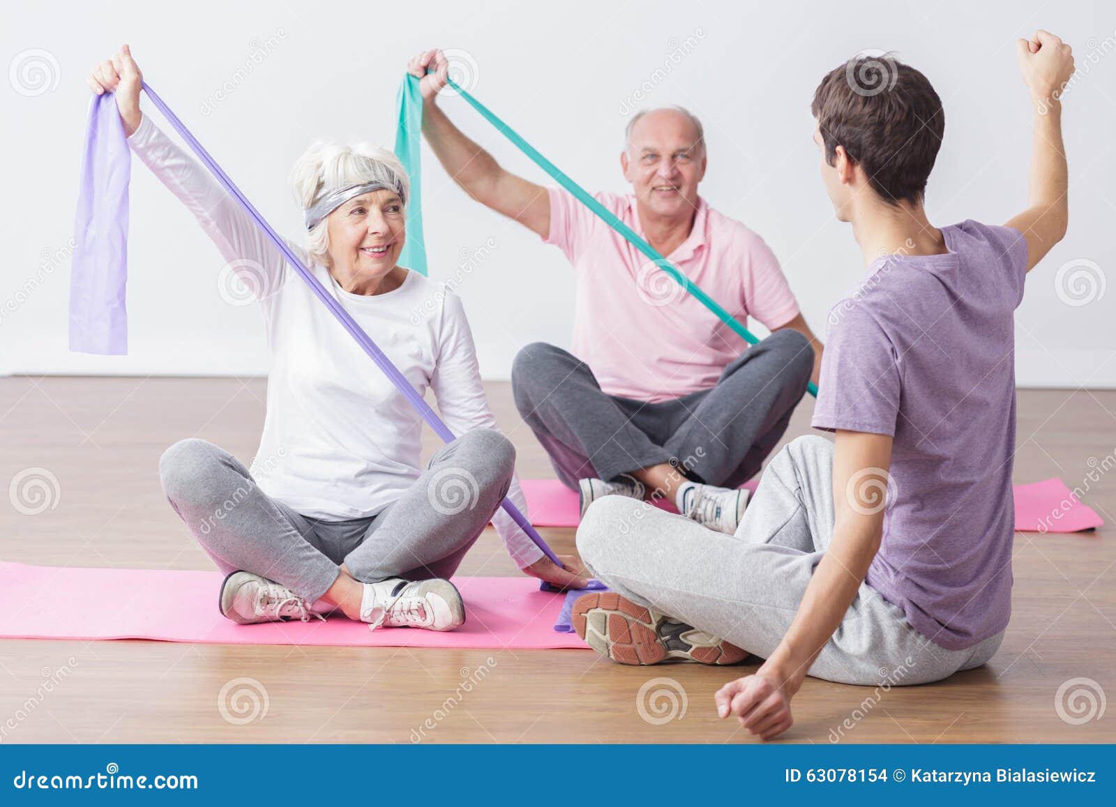 Elderly People Do Physical Exercises Stock Photo - Image of instructor ...