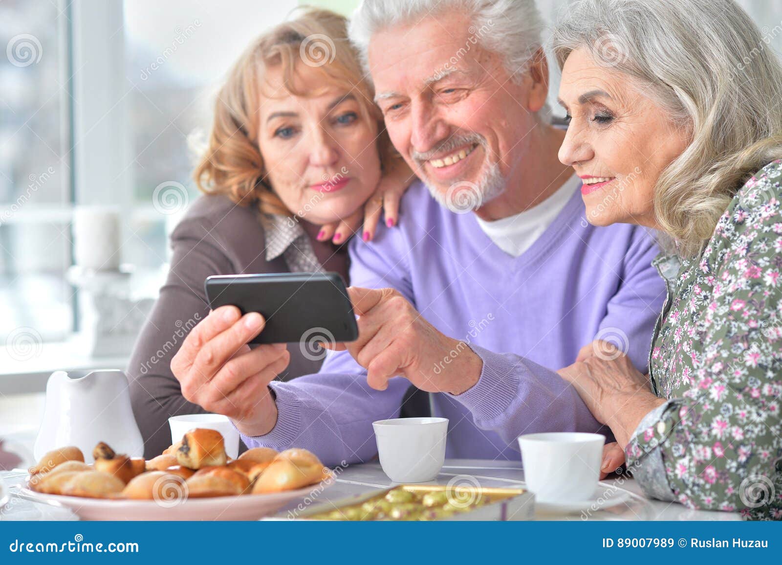 Elderly People Having Breakfast and Using Mobile Phone Stock Image ...