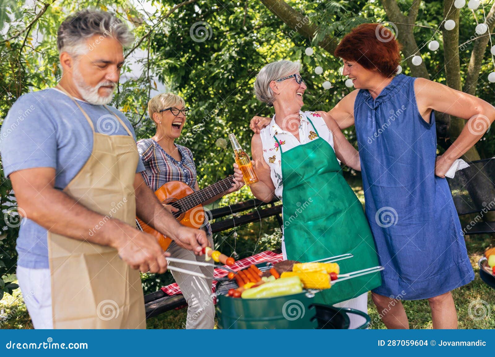 Senior People are Making Barbeque, Drinking Beverages, Making Memories ...