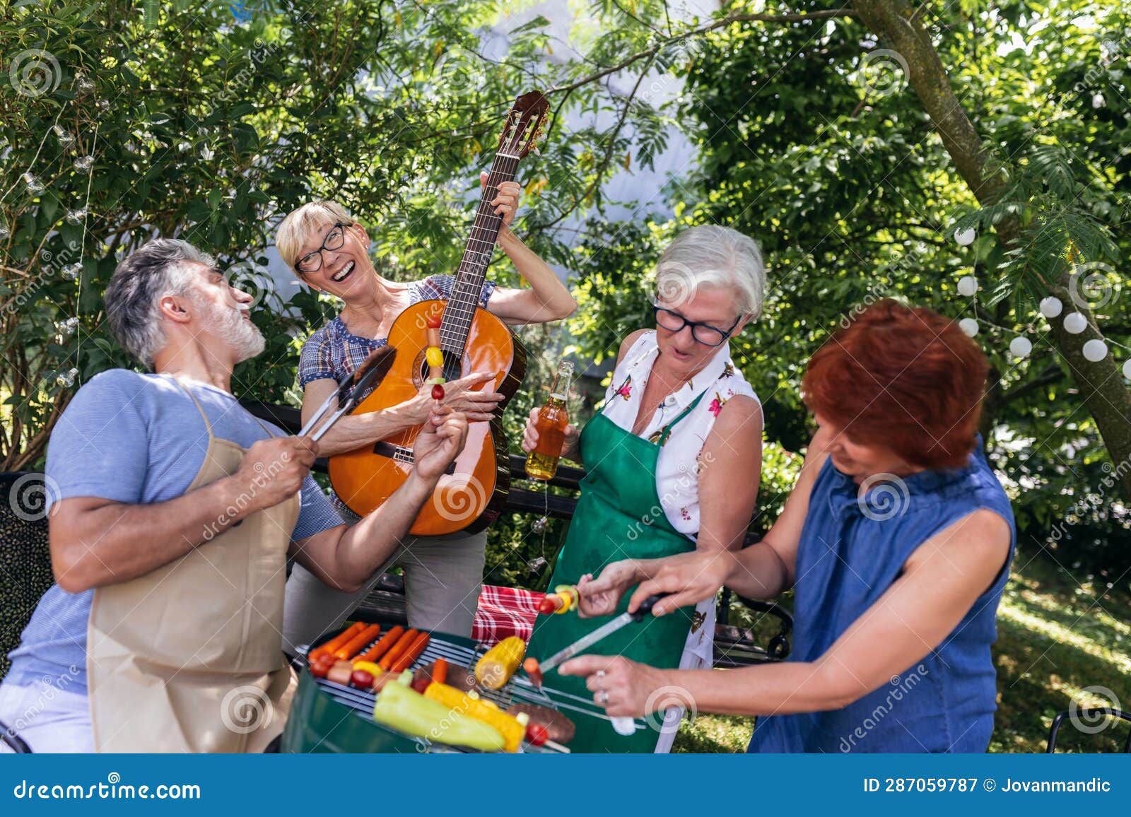 Senior People are Making Barbeque, Drinking Beverages, Making Memories ...