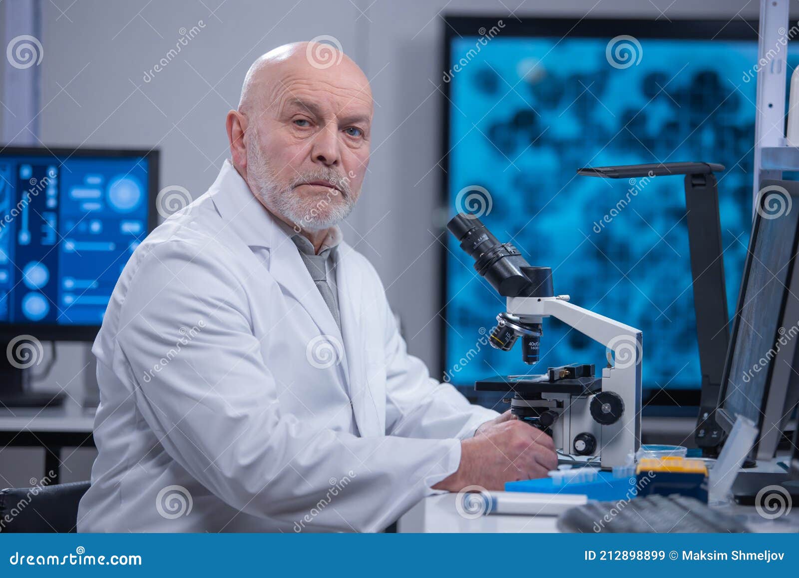 Elderly Professor is Doing a Science Experiment in a Modern Laboratory ...