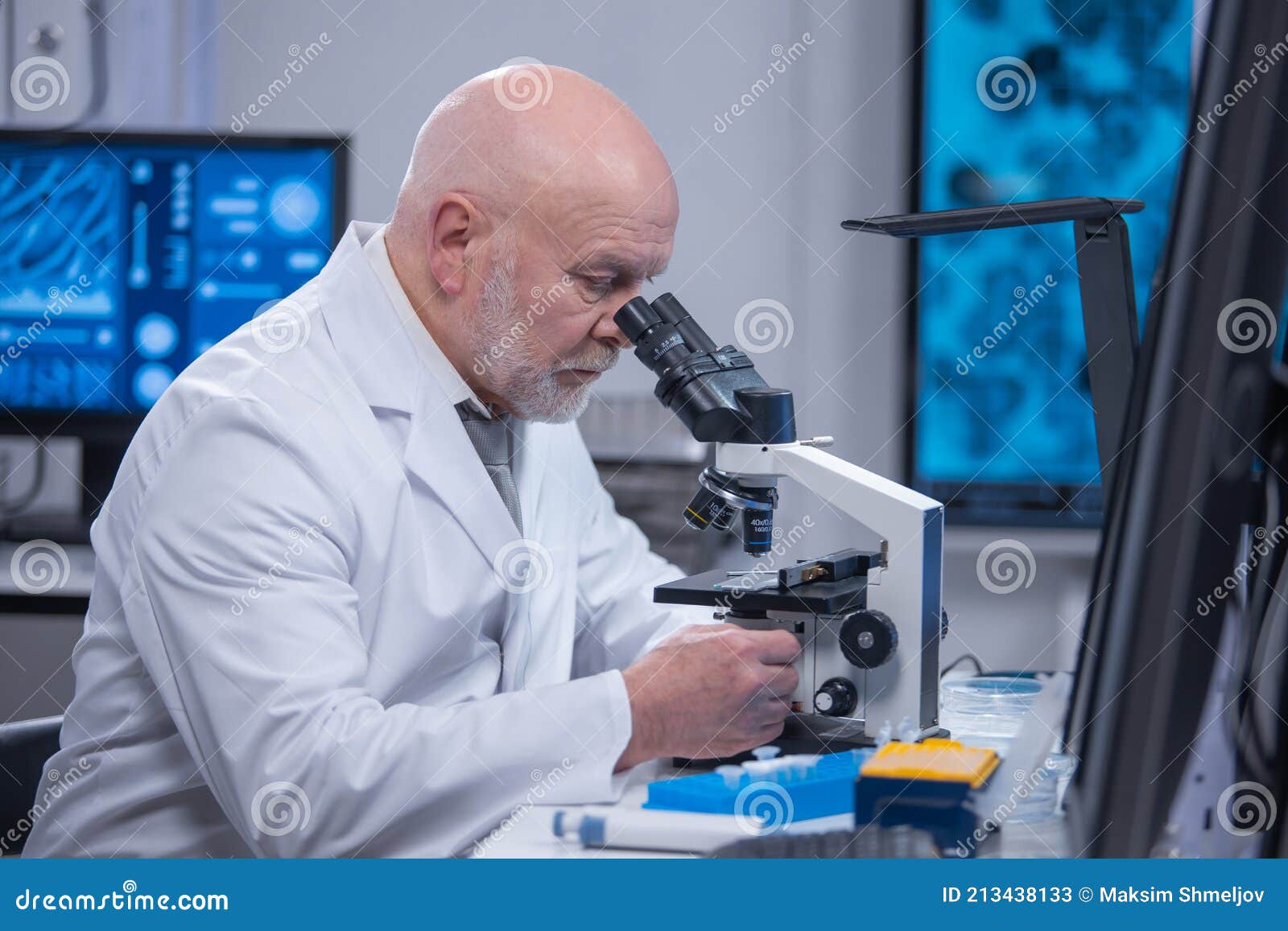Elderly Professor is Doing a Science Experiment in a Modern Laboratory ...