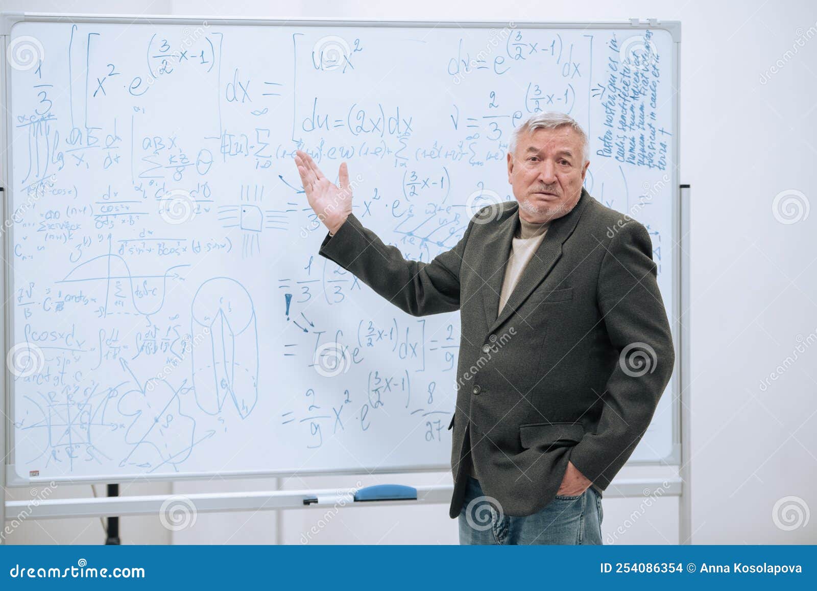 An Elderly Professor of Mathematics Stands in His Office at a White ...