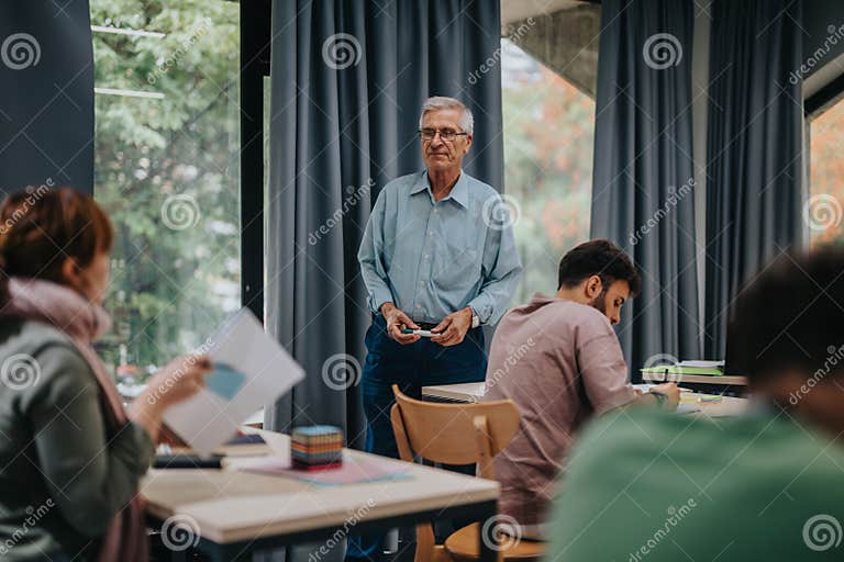 Elderly Professor Teaching Students in a Classroom Setting Stock Image ...