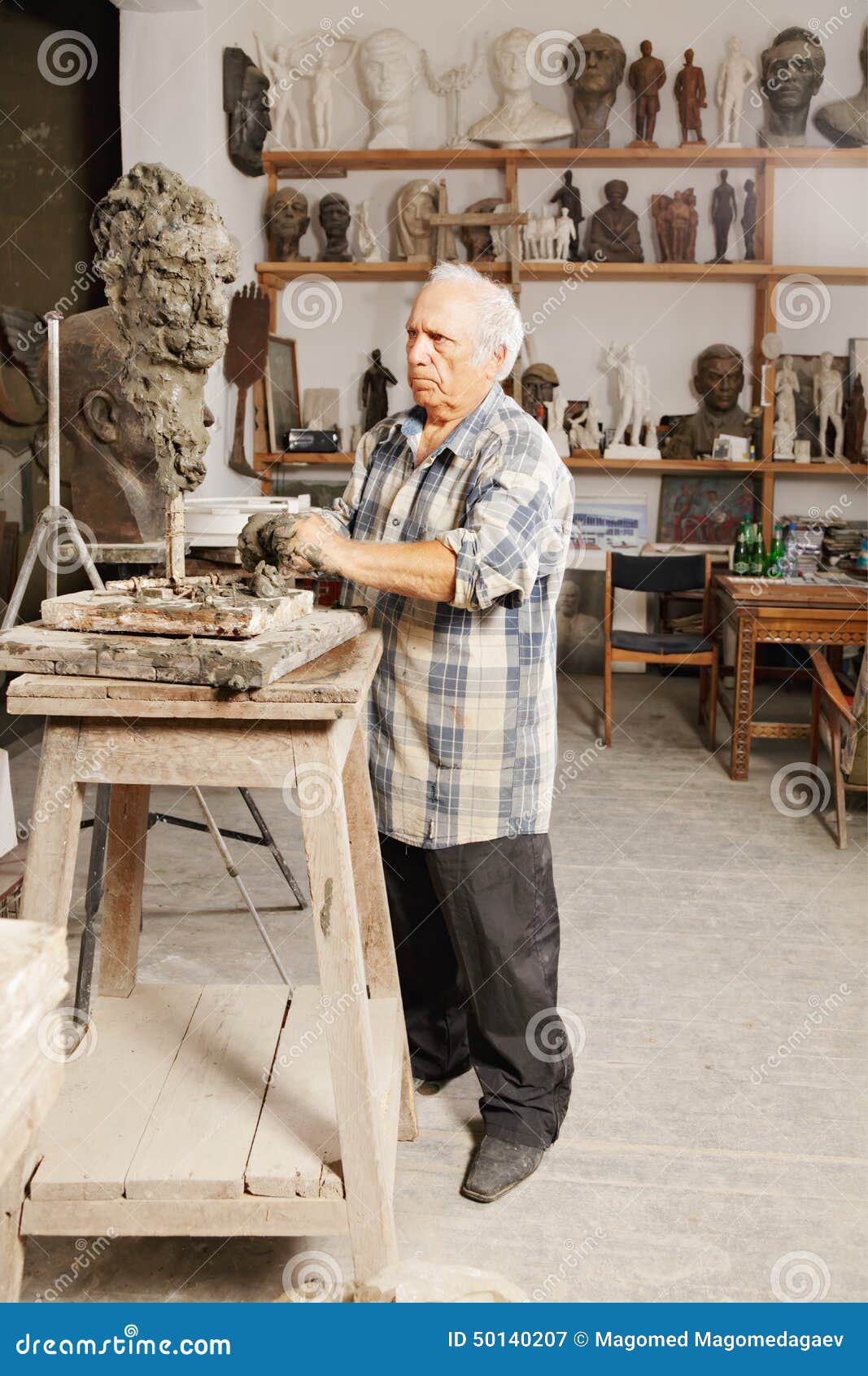 Sculptor Creates A Bust And Puts His Hands Clay On The Skeleton Of The ...