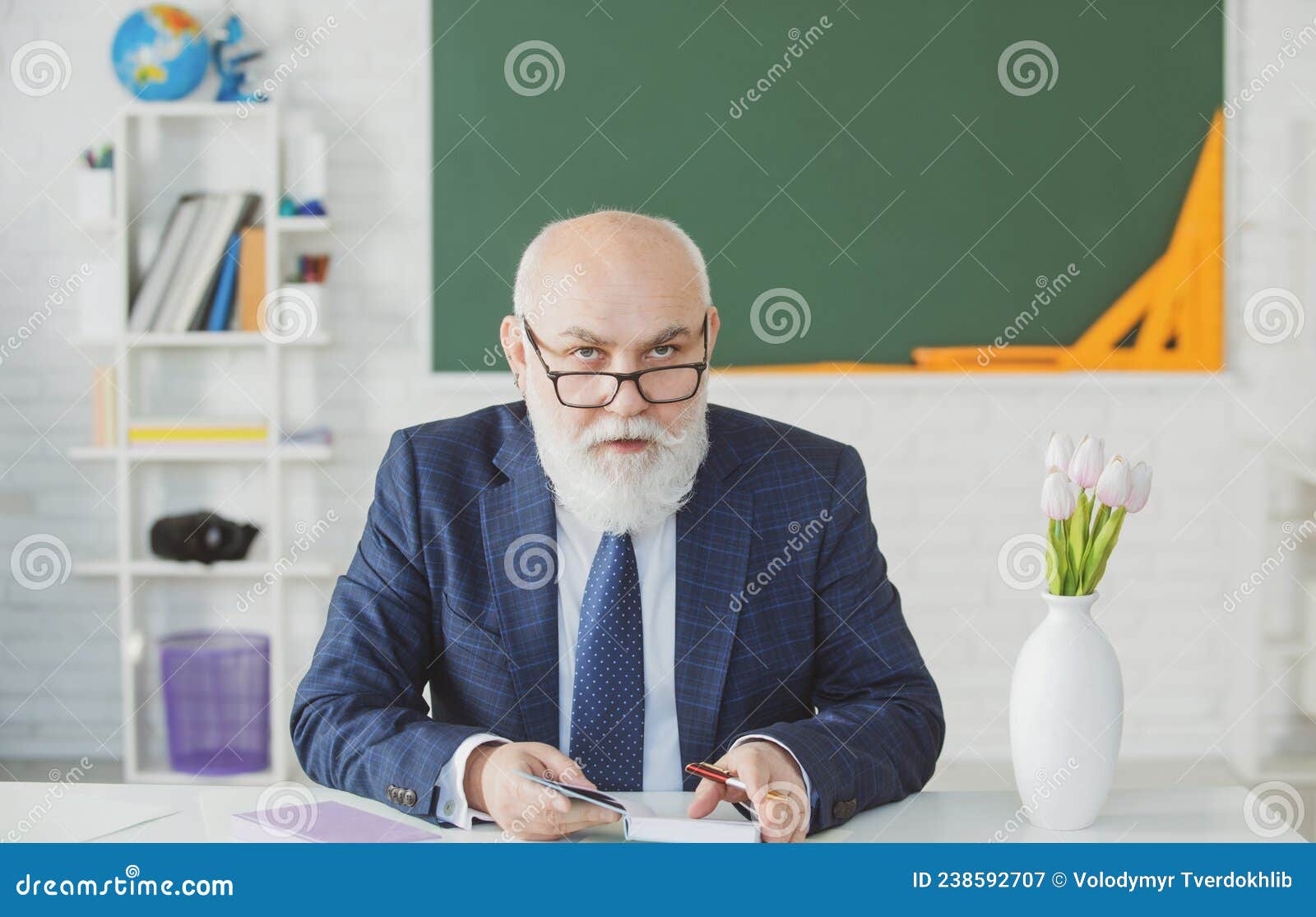 Elderly Senior Professor Reading an Old Book in the Library, Knowledge ...