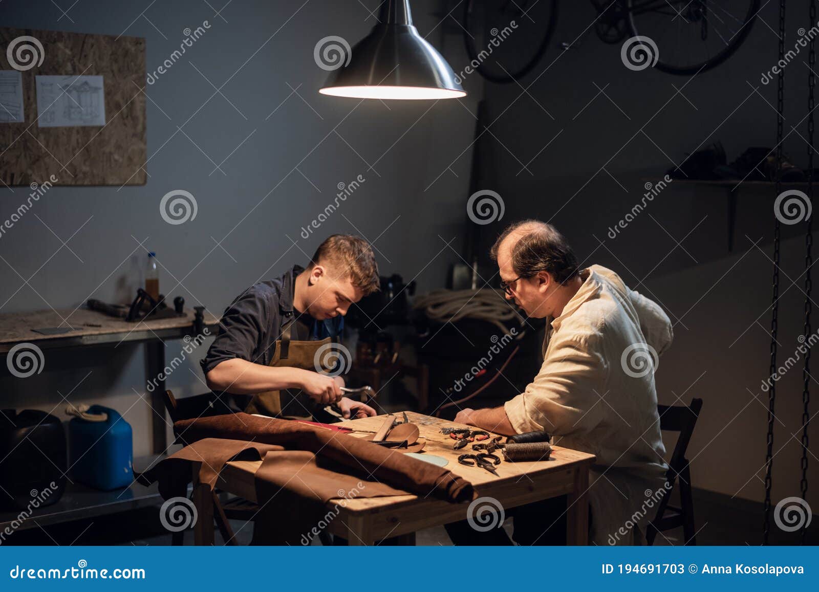 An Elderly Shoemaker and His Apprentice Create Shoes by Hand in Their ...