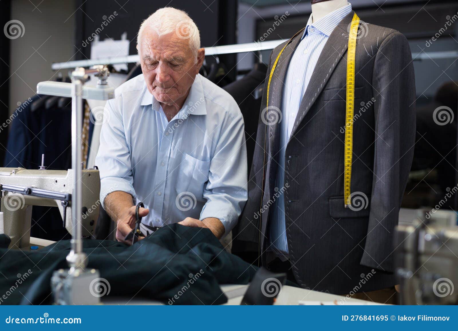 Elderly Tailor Cuts Fabric with Scissors at Workplace in Workshop Stock ...