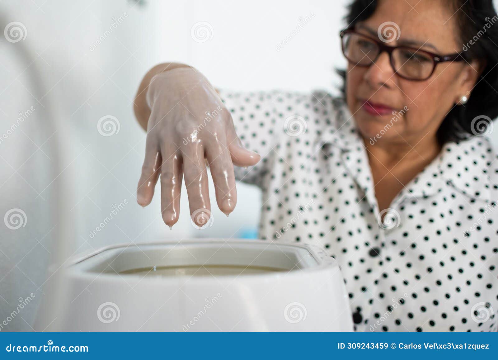 Elderly Woman Doing Wax Therapy for Arthritis Stock Image - Image of ...
