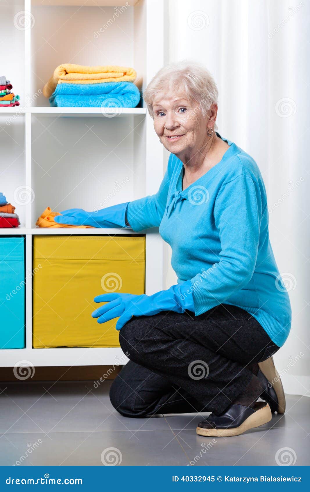 Elderly Woman Dusting Shelves Stock Image - Image of closeup ...