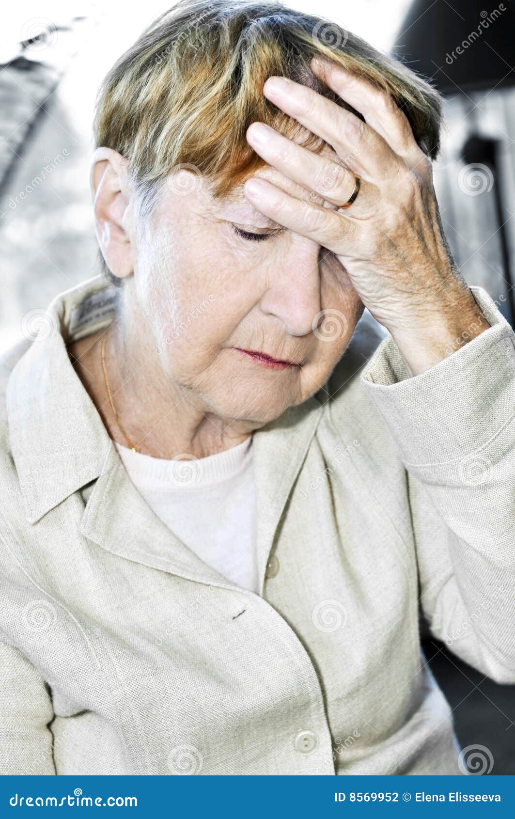 Elderly woman holding head stock photo. Image of holding - 8569952