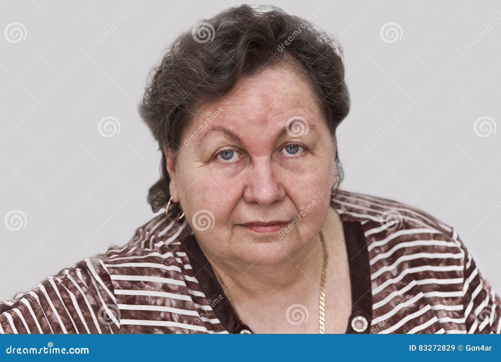 Elderly Woman with Large Expressive Eyes,looking Right into the Lens ...