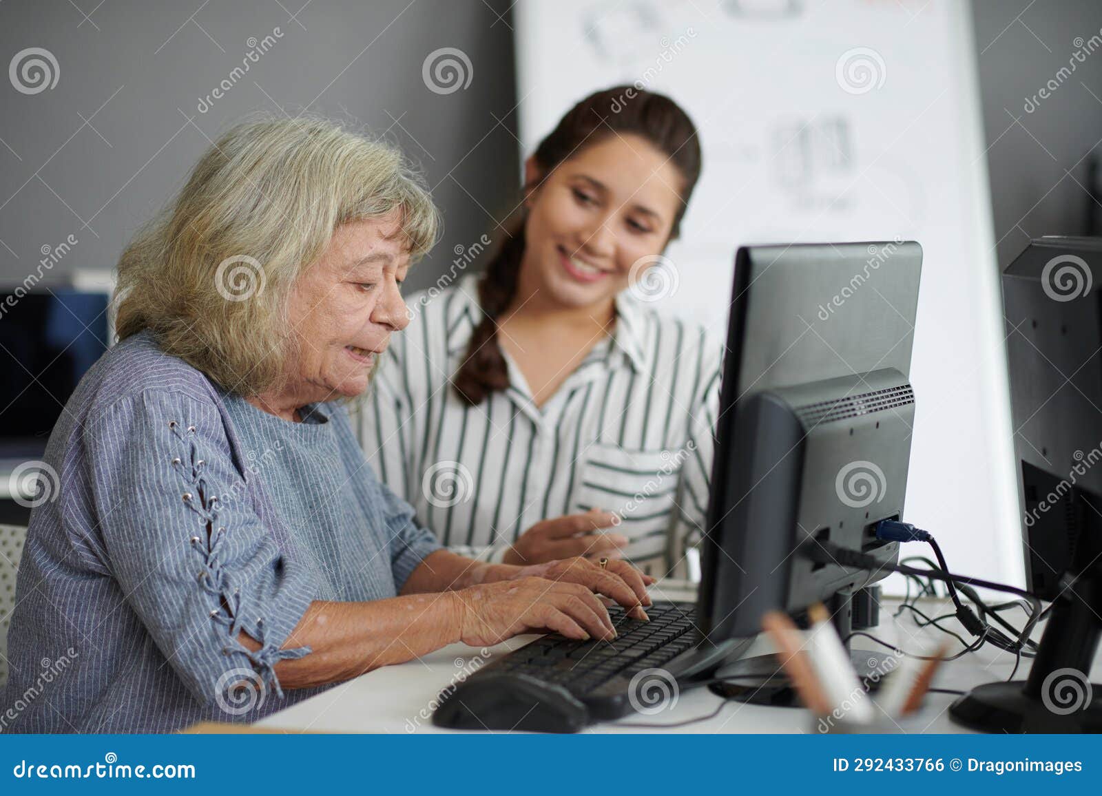 Elderly Woman Typing on Computer Stock Photo - Image of smiling ...