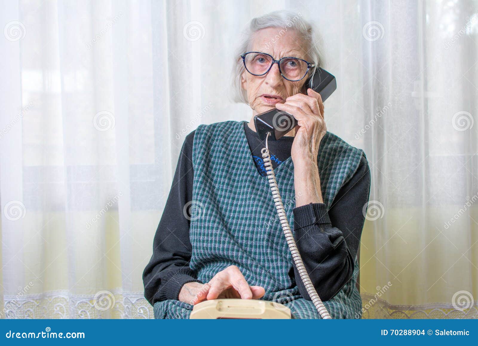 Elderly Woman Using the Phone Indoors Stock Photo - Image of limited ...