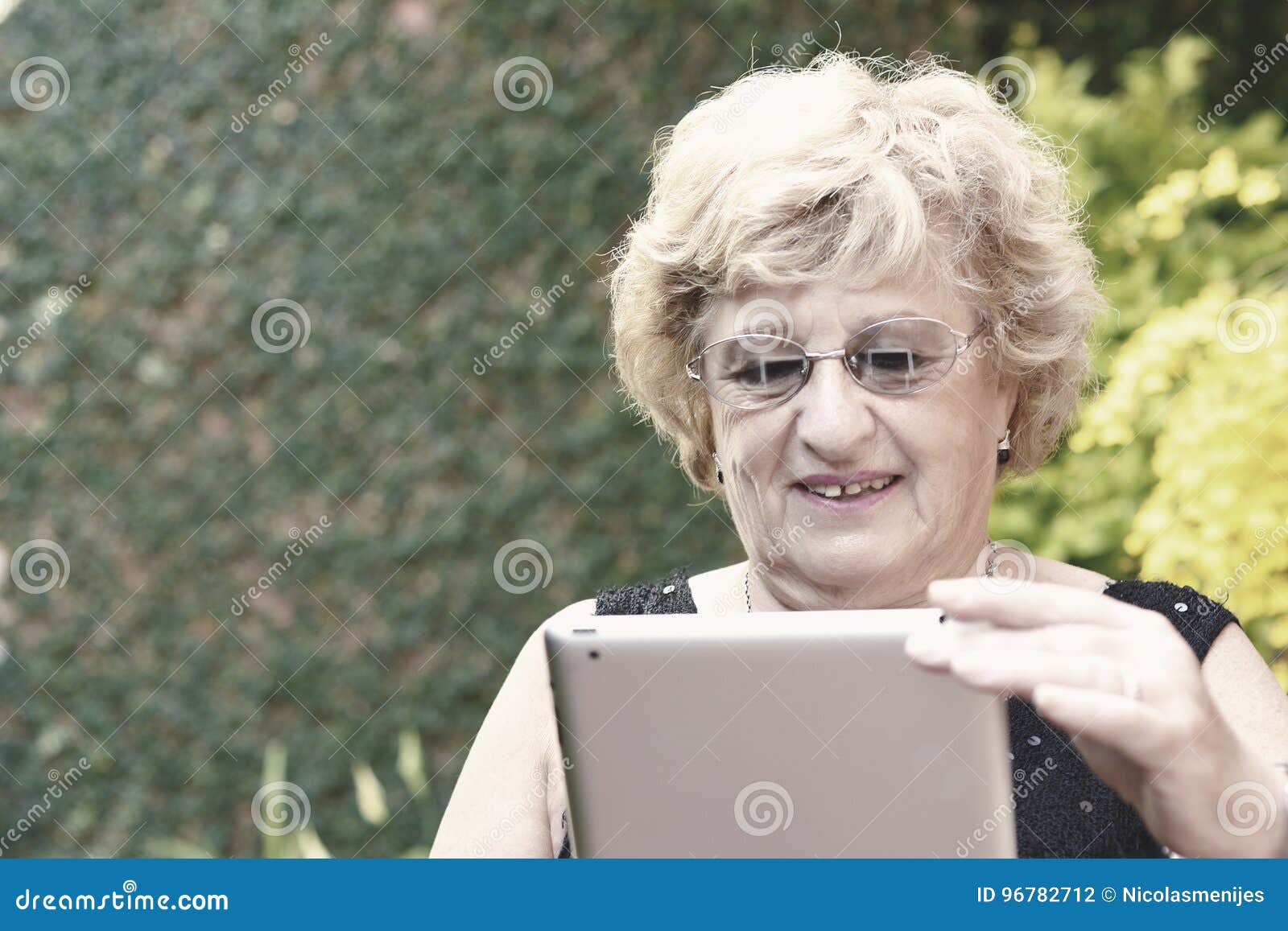 Elderly Woman Using Tablet. Stock Photo - Image of aged, natural: 96782712