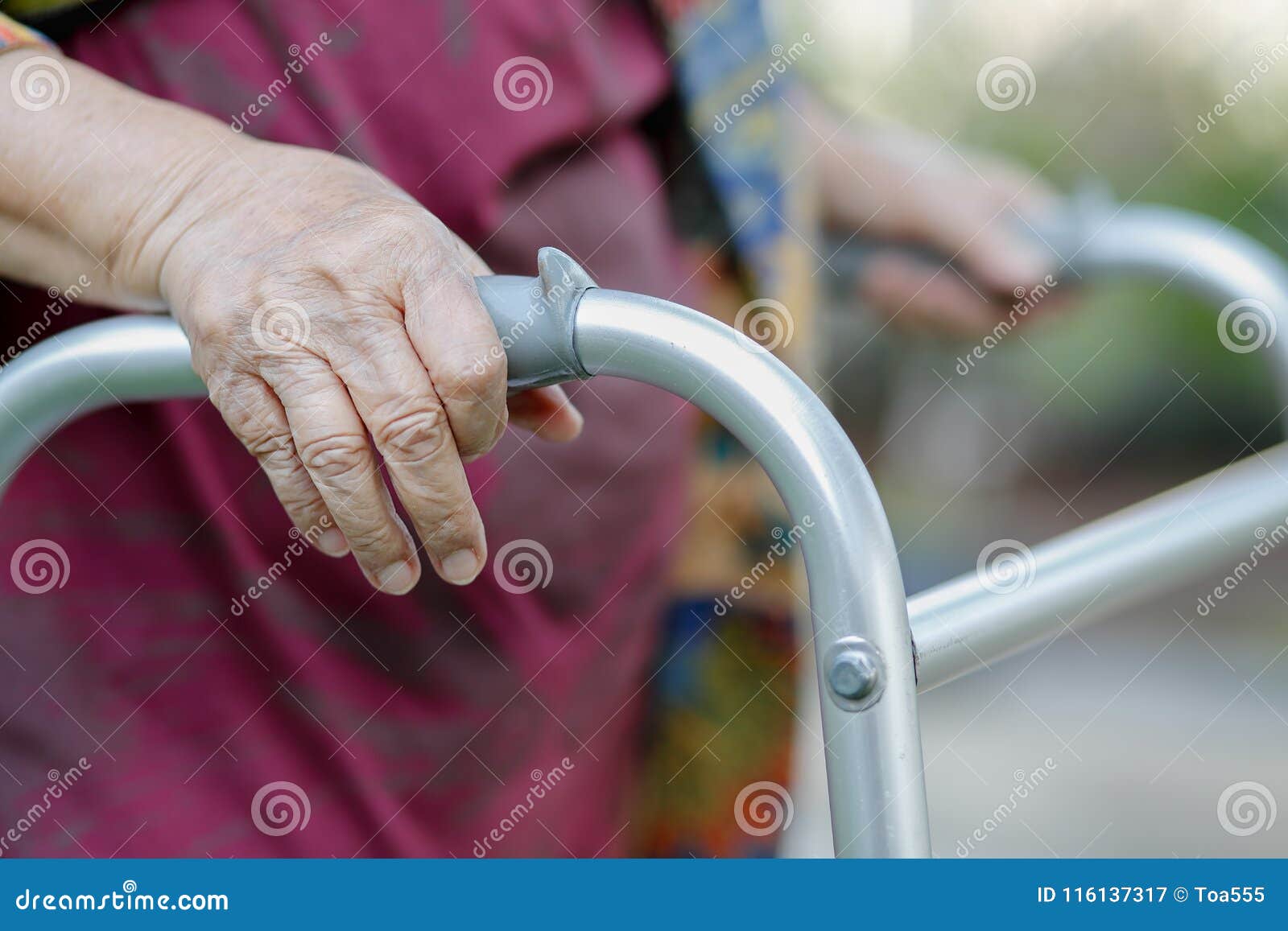 Elderly Woman Using a Walker in Backyard Stock Image - Image of ...