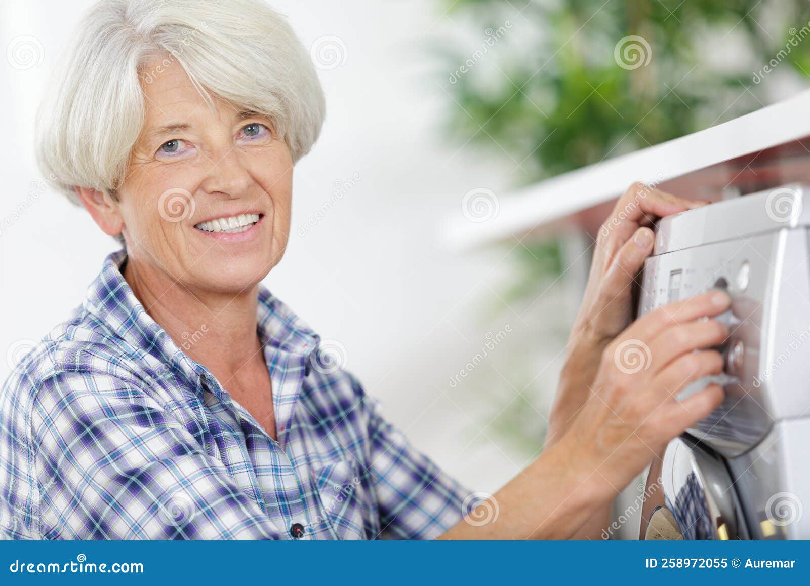 Elderly Woman with Washing Machine Stock Image - Image of smile ...